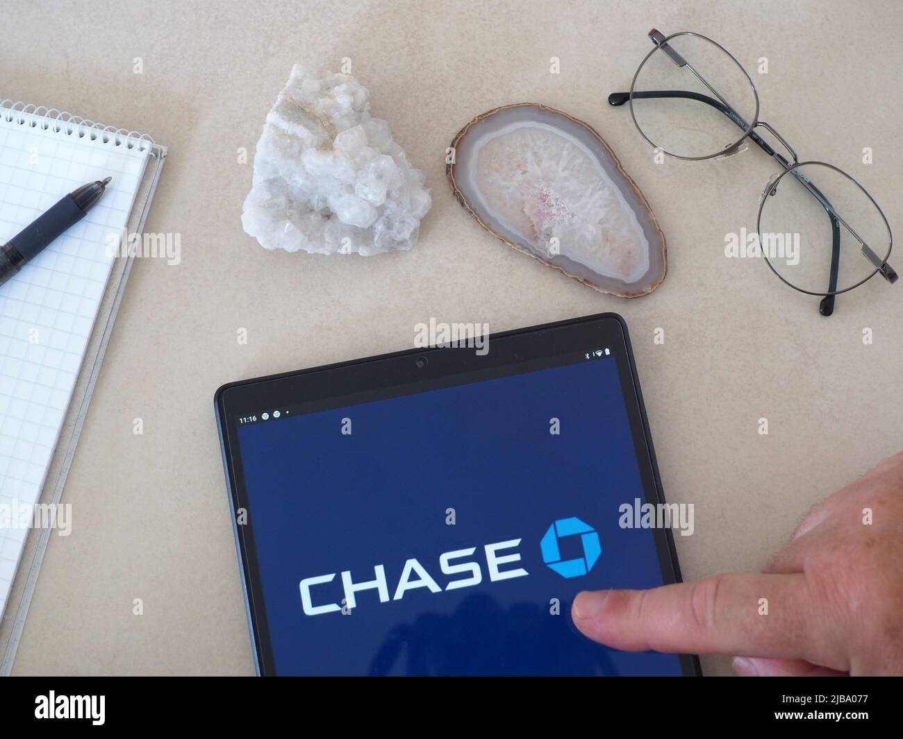 In this photo illustration Chase logo seen displayed on a tablet Stock ...