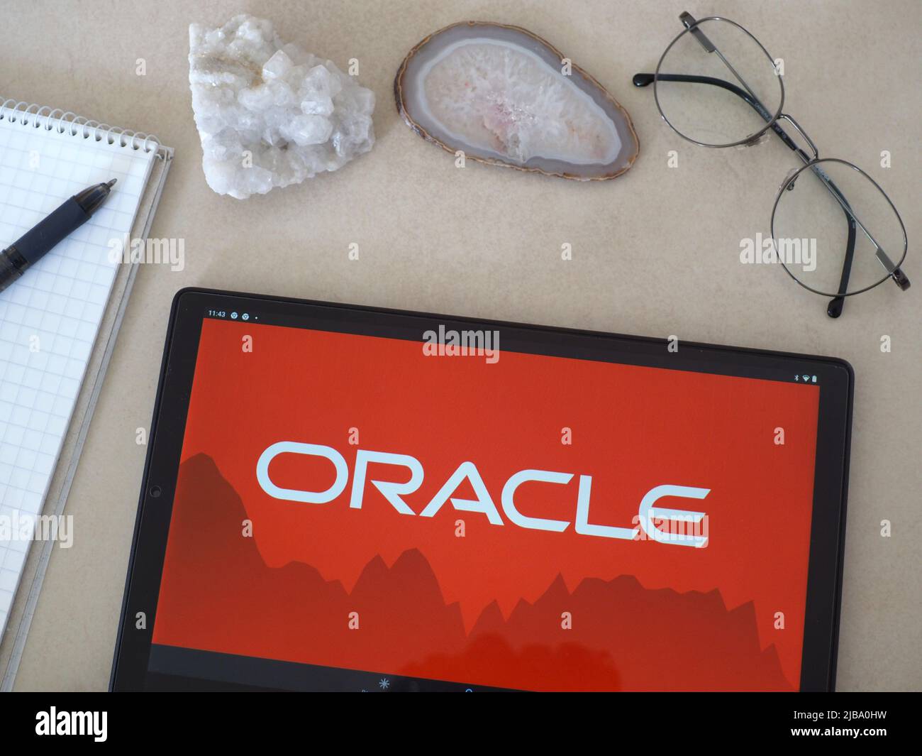 In this photo illustration Oracle Corporation logo seen displayed on a ...