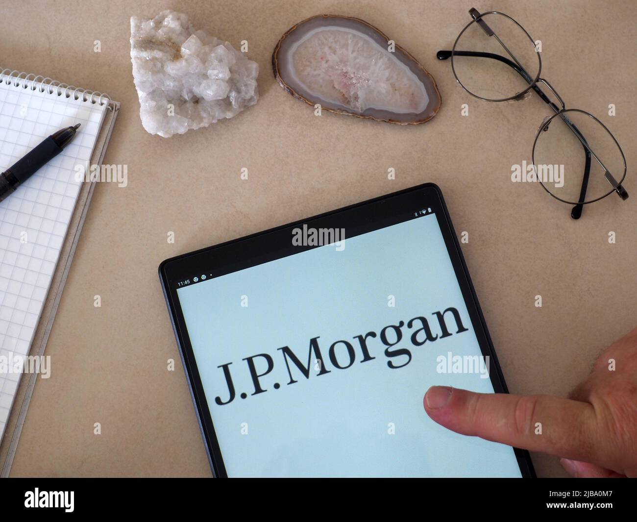 In this photo illustration J.P. Morgan & Co. logo seen displayed on a ...