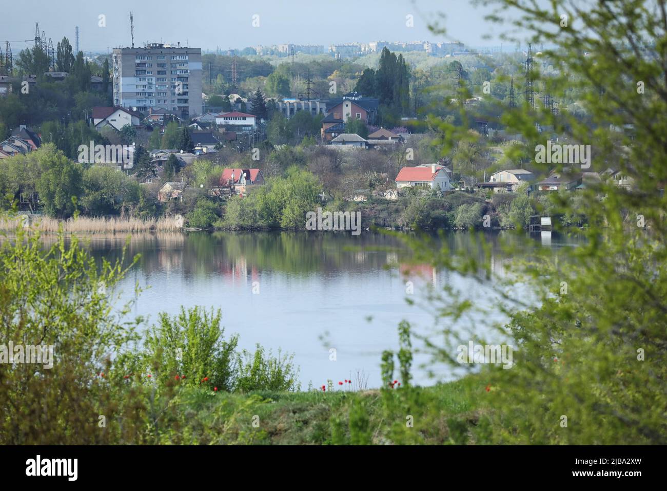 city view with trees and lake Stock Photo - Alamy
