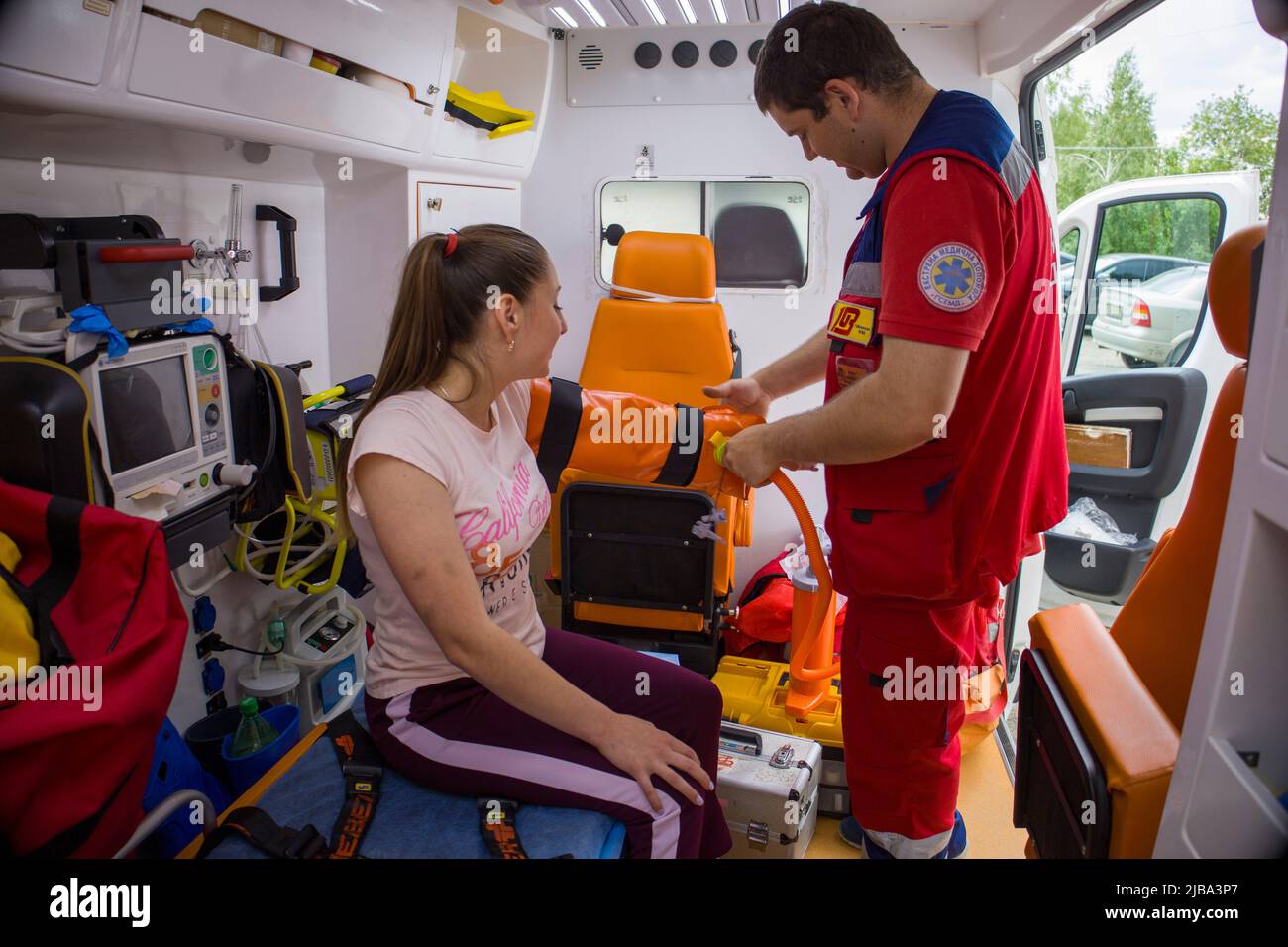 Kyiv. Ukraine. 2.06.2022. An ambulance paramedic treats the girl Stock ...