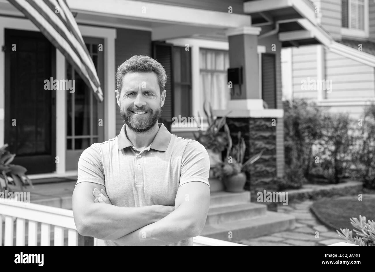 happy bearded man realtor selling or renting house, copy space ...