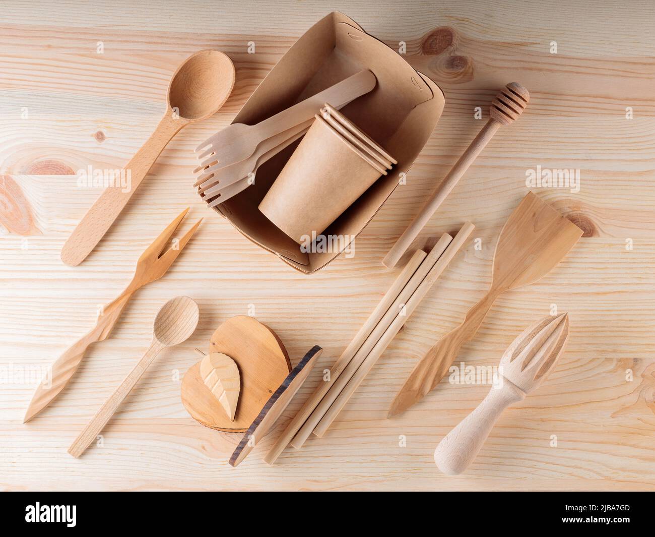 Various kitchen utensils on a wooden table. Set of the wooden cutlery ...