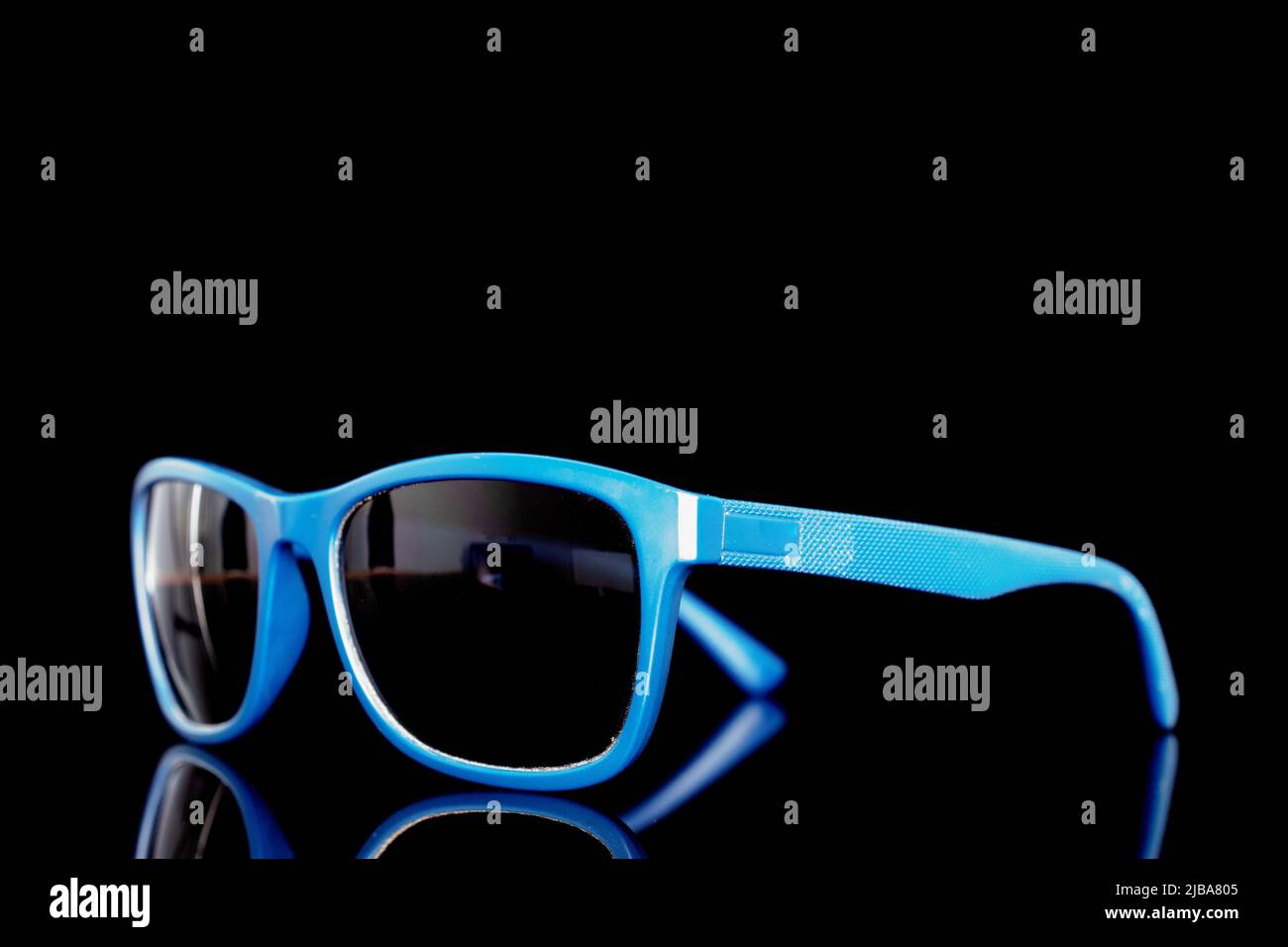 One glasses, close-up, isolated on a black background Stock Photo - Alamy