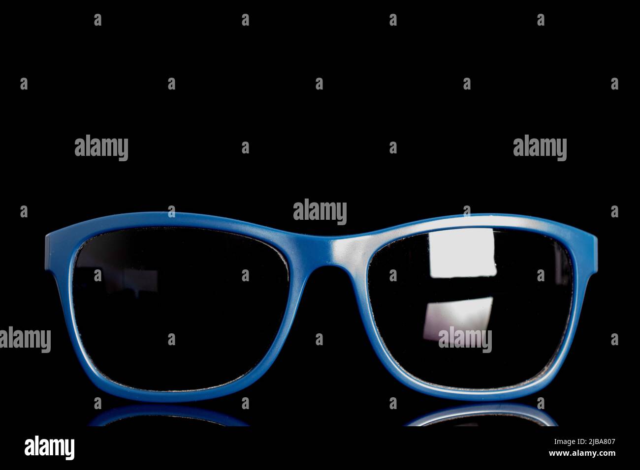 One glasses, close-up, isolated on a black background Stock Photo - Alamy