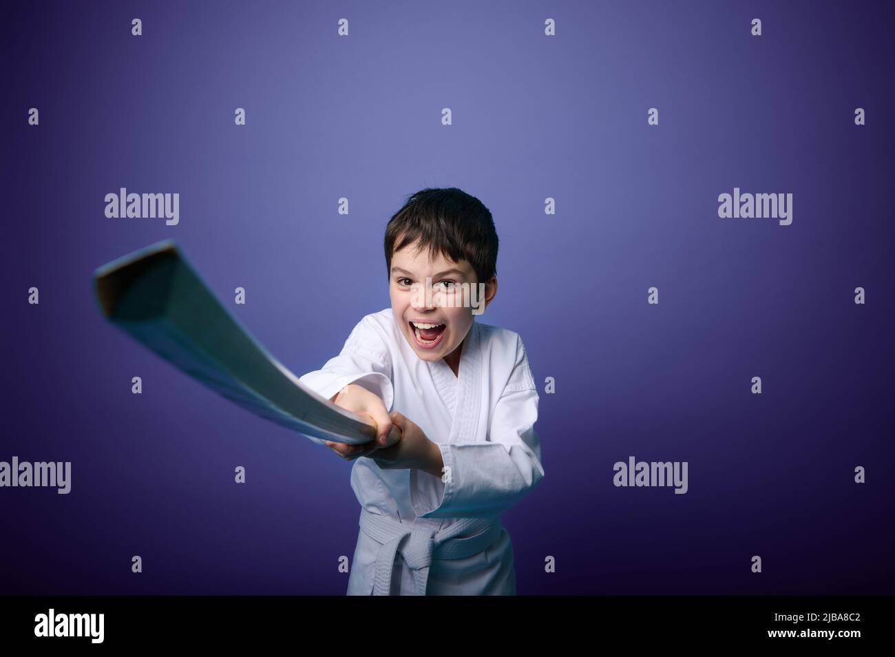 Portrait of a confident strong European teenage boy aikido fighter ...