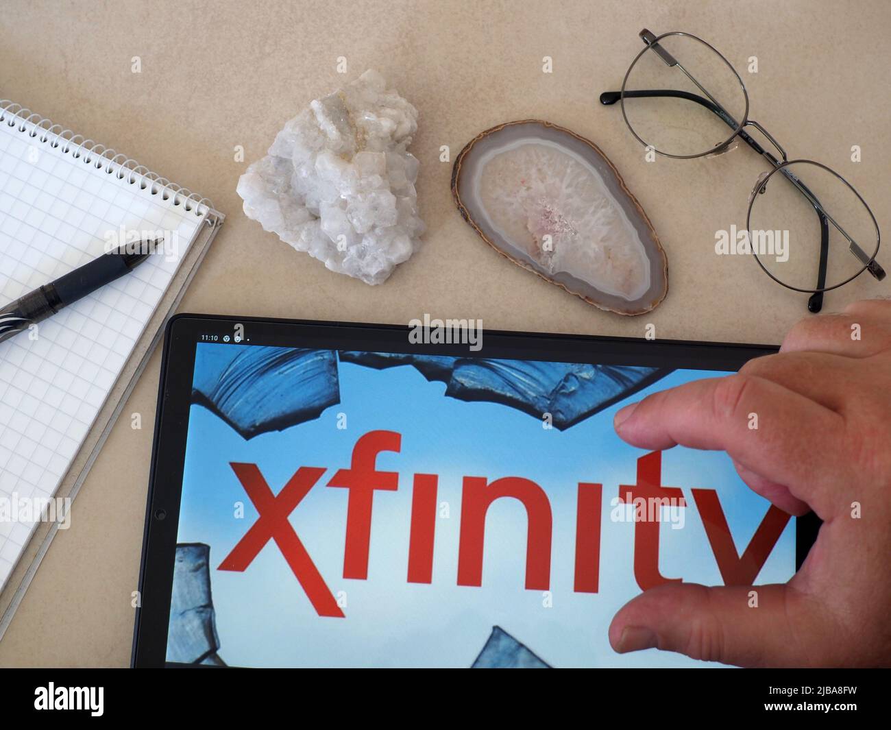 In this photo illustration a Comcast Cable Communications, LLC, doing ...