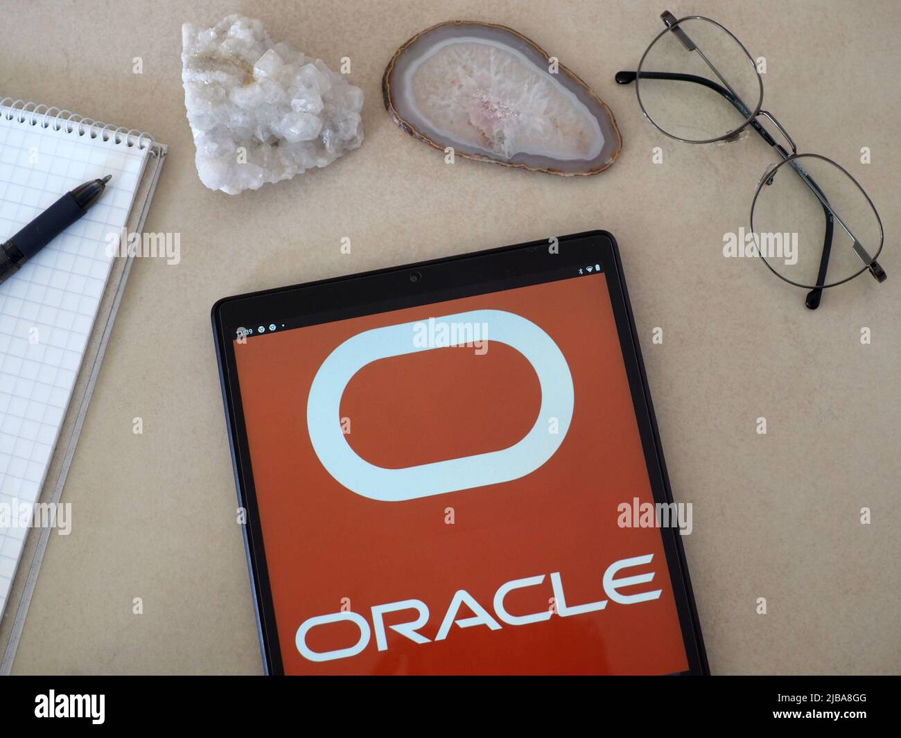 In this photo illustration an Oracle Corporation logo seen displayed on ...