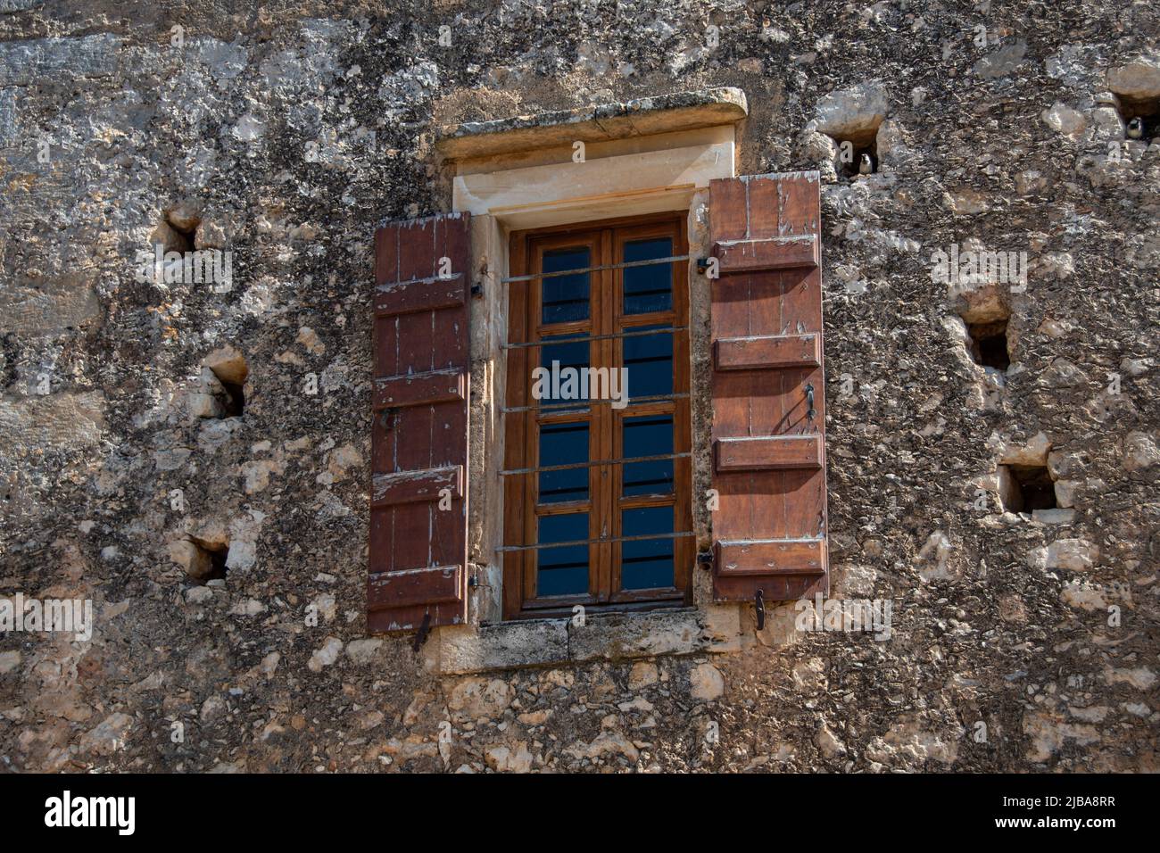 Old rustic window with cooling holes in the masonry Stock Photo - Alamy