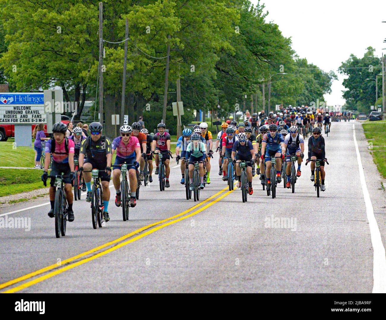EMPORIA, KANSAS - JUNE 4, 2022 Unbound Gravel riders get a seven A.M ...