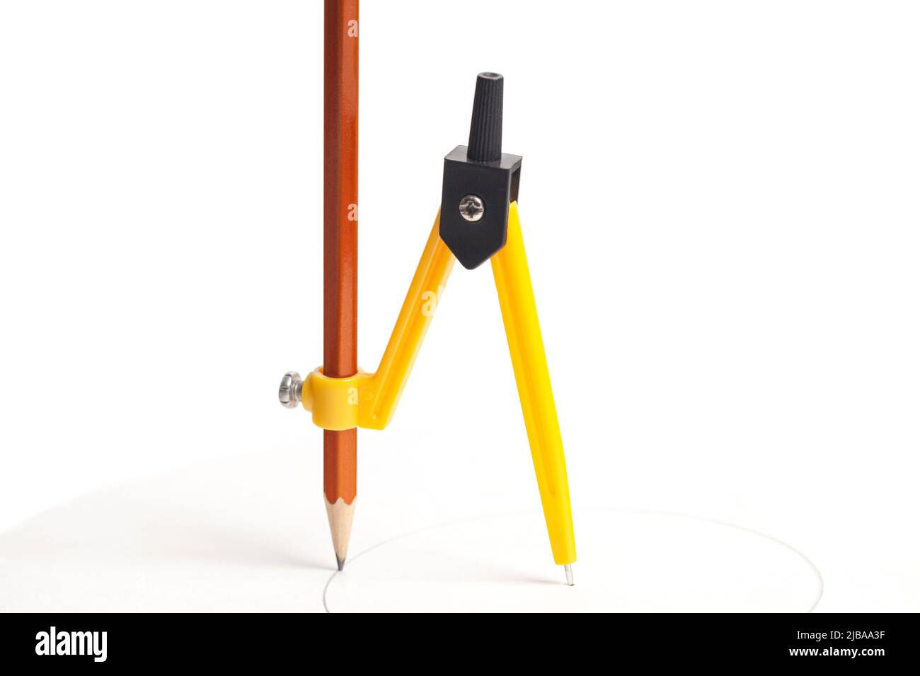 Yellow compass with pencil isolated on white background Stock Photo - Alamy