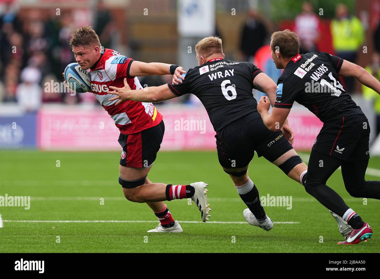 Freddie Clarke of Gloucester Rugby gets past Jackson Wray of Saracens ...