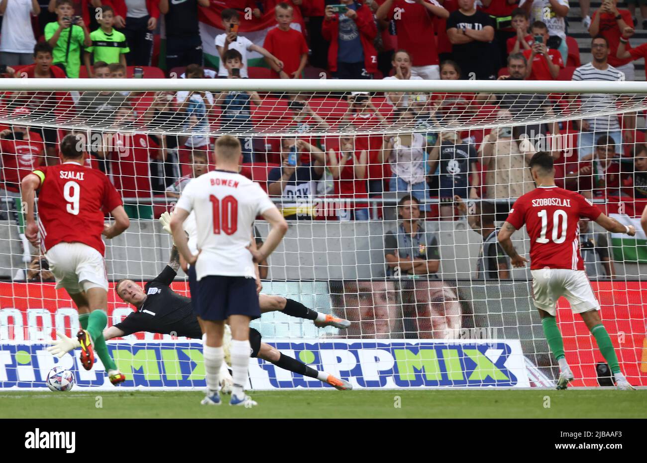 Hungary's Dominik Szoboszlai (right) scores their side's first goal of ...