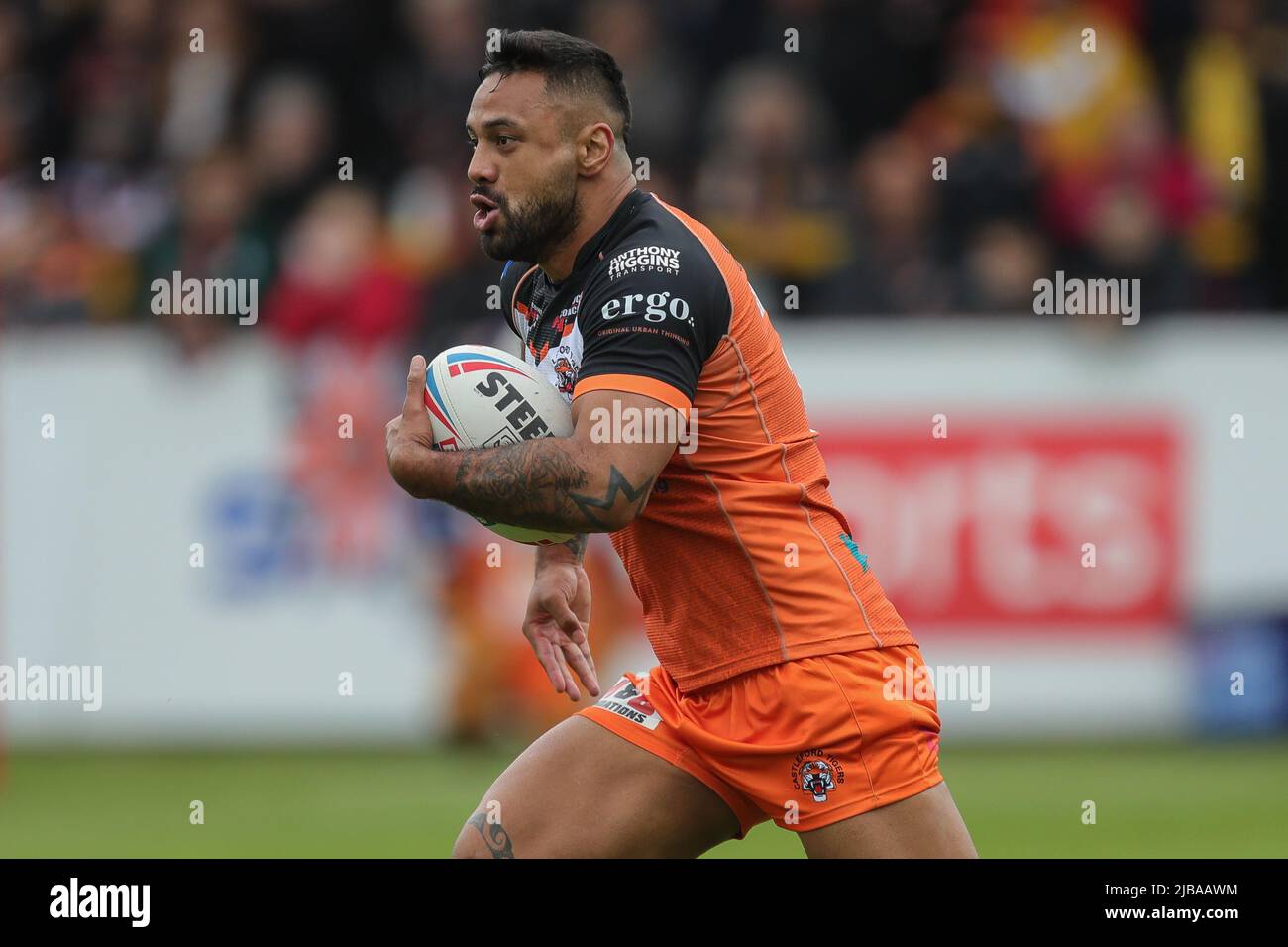 Kenny Edwards #11 of Castleford Tigers runs with the ball Stock Photo ...