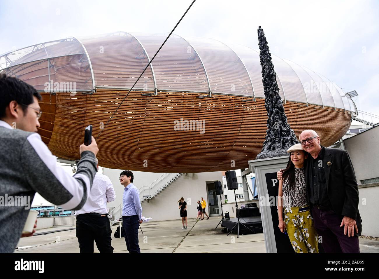 The Pillar of Shame statue by Danish artist Jens Galschiot (front) to ...