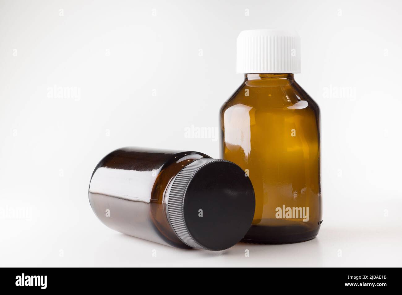 medical jars with dark glass caps for tablets Stock Photo - Alamy