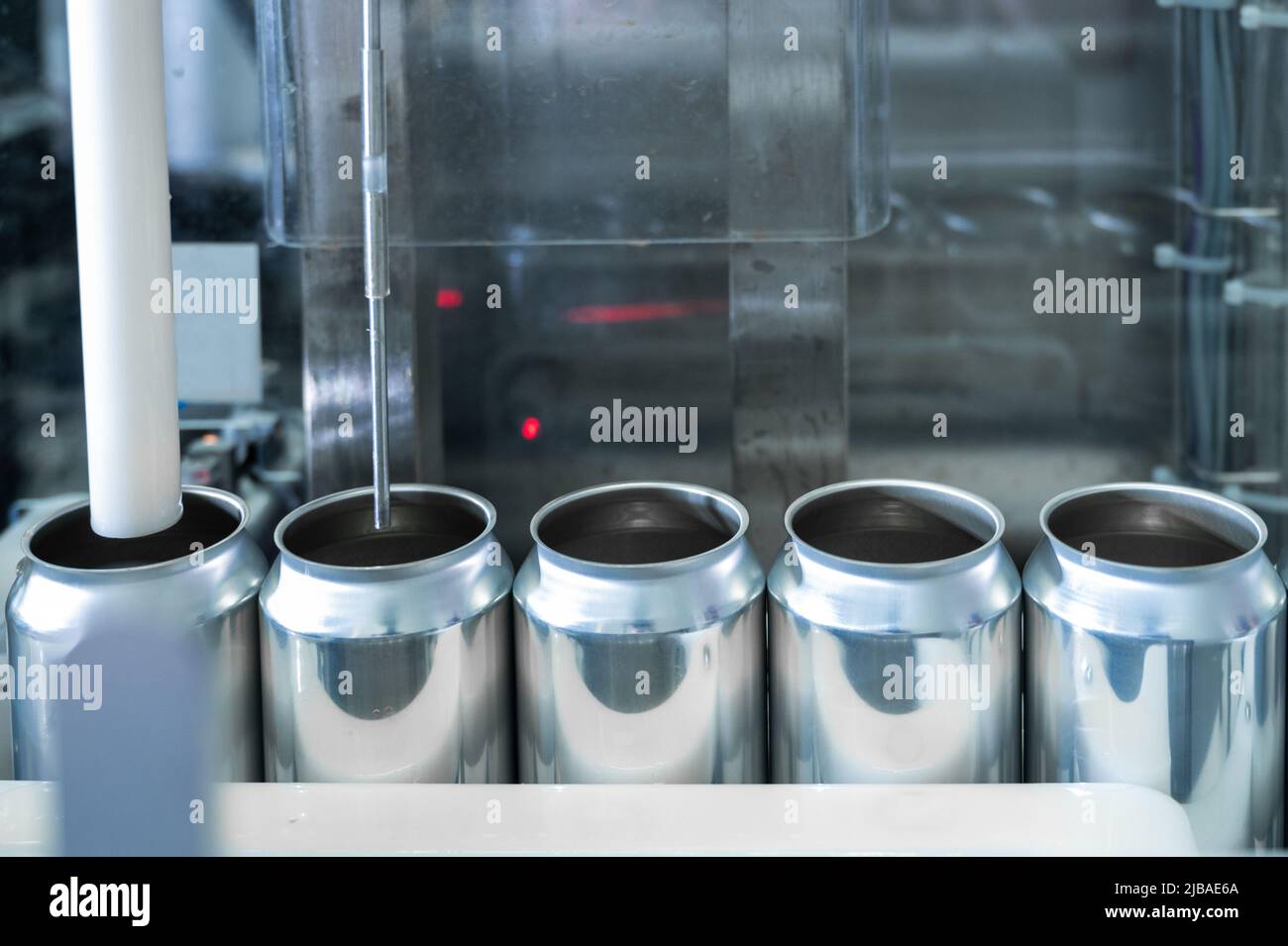 Empty new aluminum cans for drink process in factory line on conveyor ...