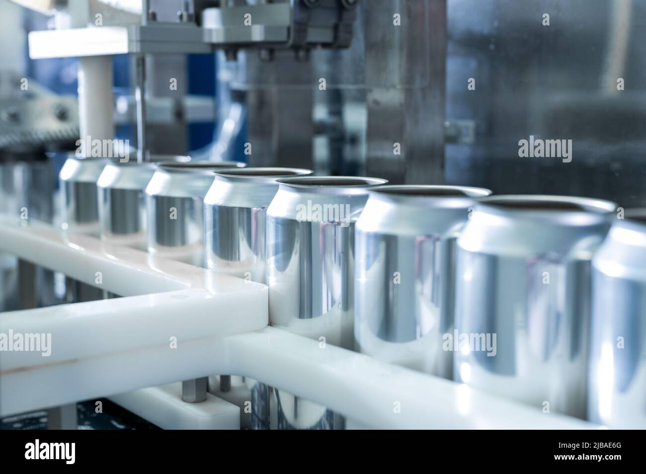 Empty new aluminum cans for drink process in factory line on conveyor ...