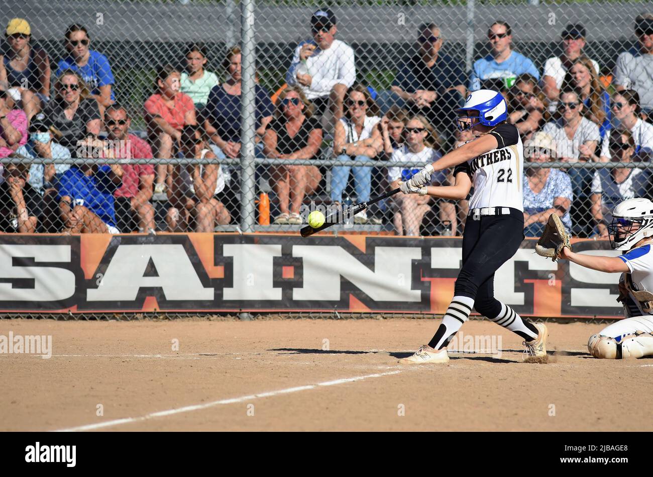 USA. Player narrowly missing a grand slam home run as bat meets ball on ...