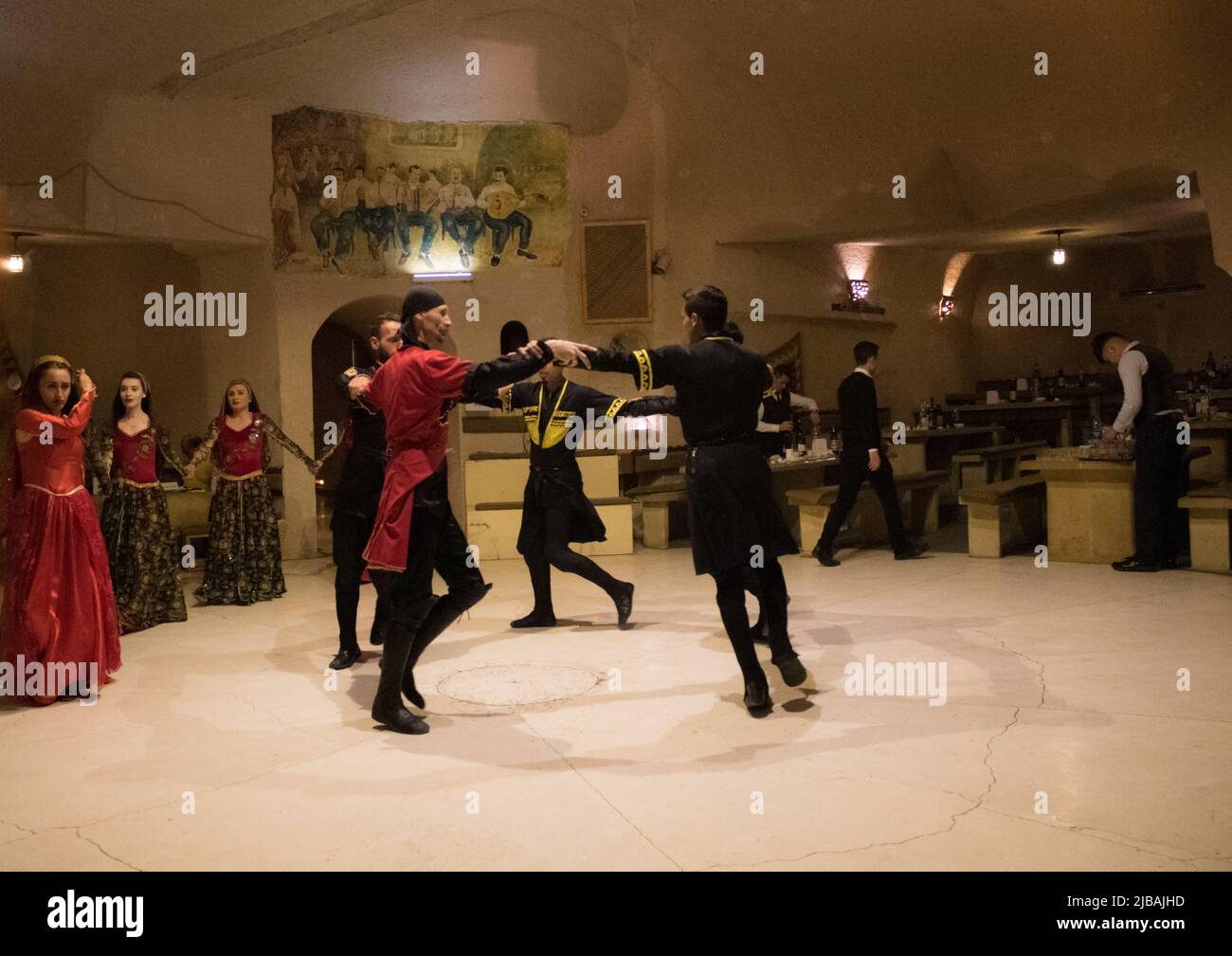 Traditional Turkish dancers dance for tourists in a local restaurant ...
