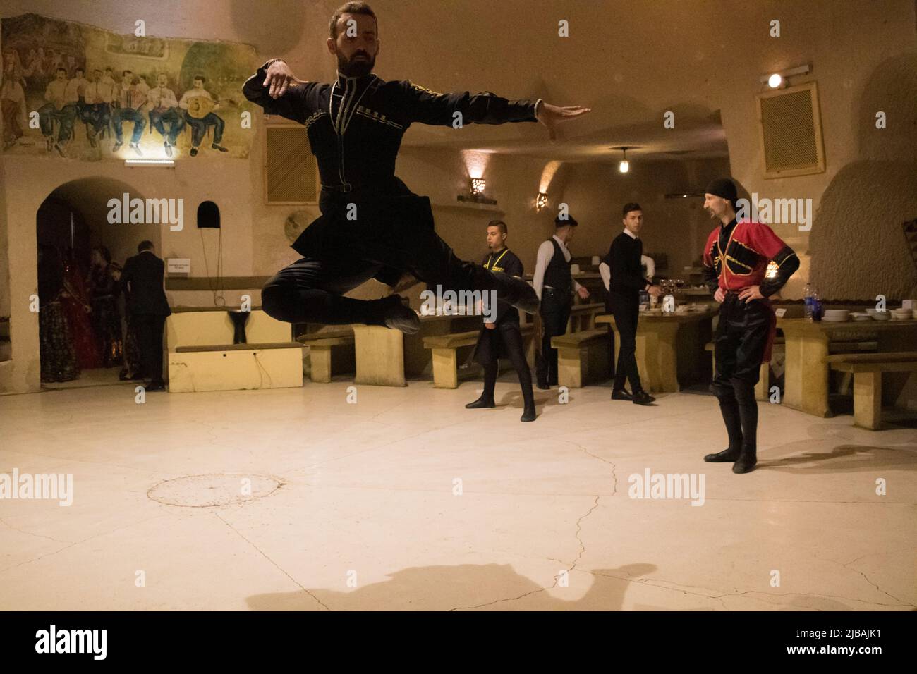 Traditional Turkish dancers dance for tourists in a local restaurant ...