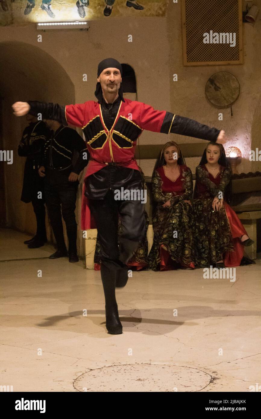 Traditional Turkish dancers dance for tourists in a local restaurant ...