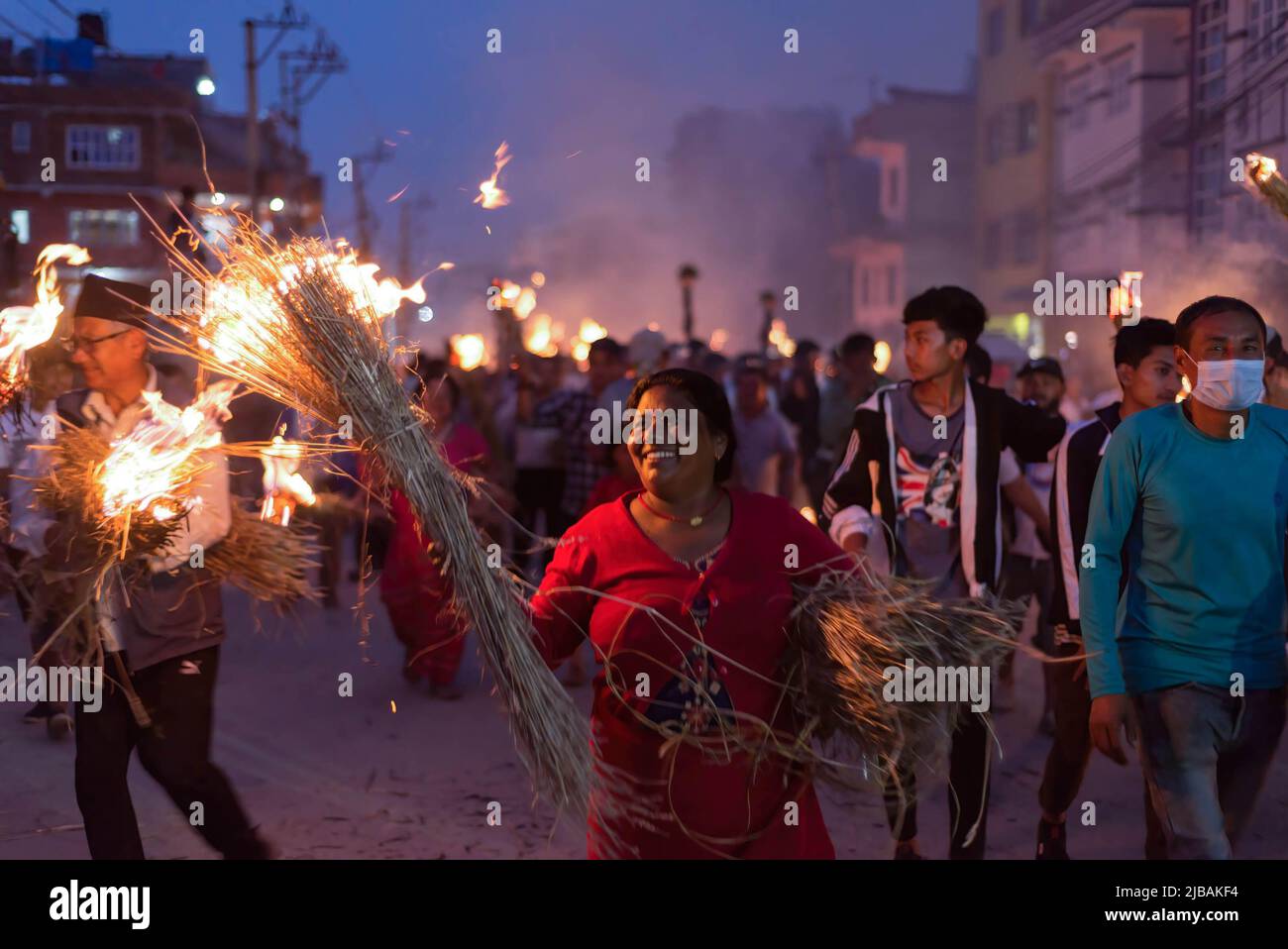 Devotees light traditional torches on the last day of the Rato ...