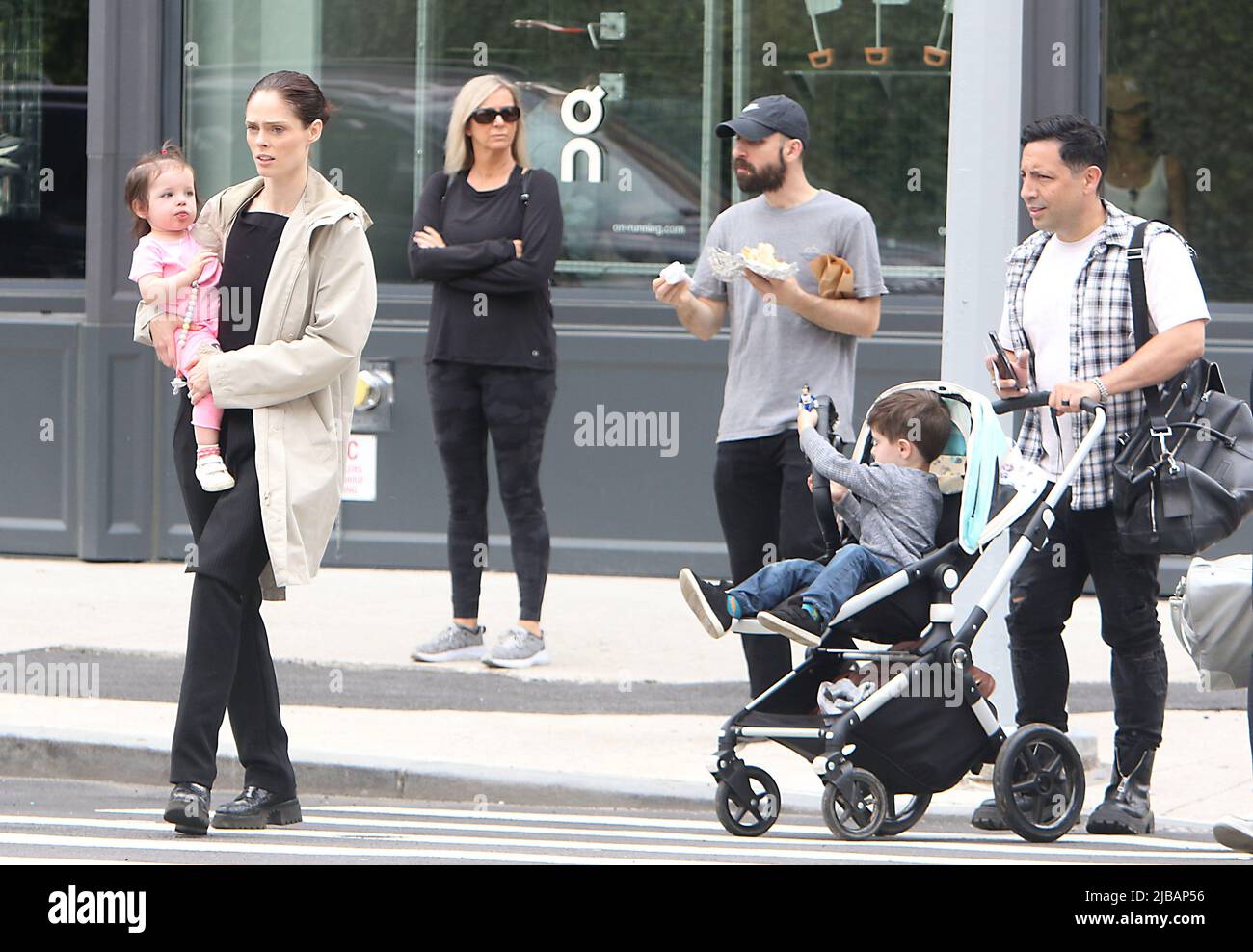 June 03, 2022.Coco Rocha, James Conran, and family walking in Soho in ...