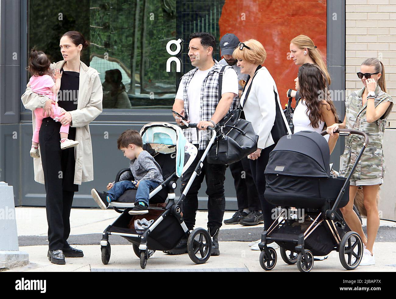 June 03, 2022.Coco Rocha, James Conran, and family walking in Soho in ...