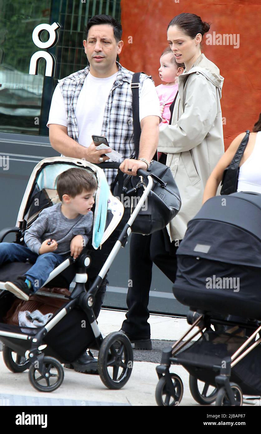 June 03, 2022.Coco Rocha, James Conran, and family walking in Soho in ...
