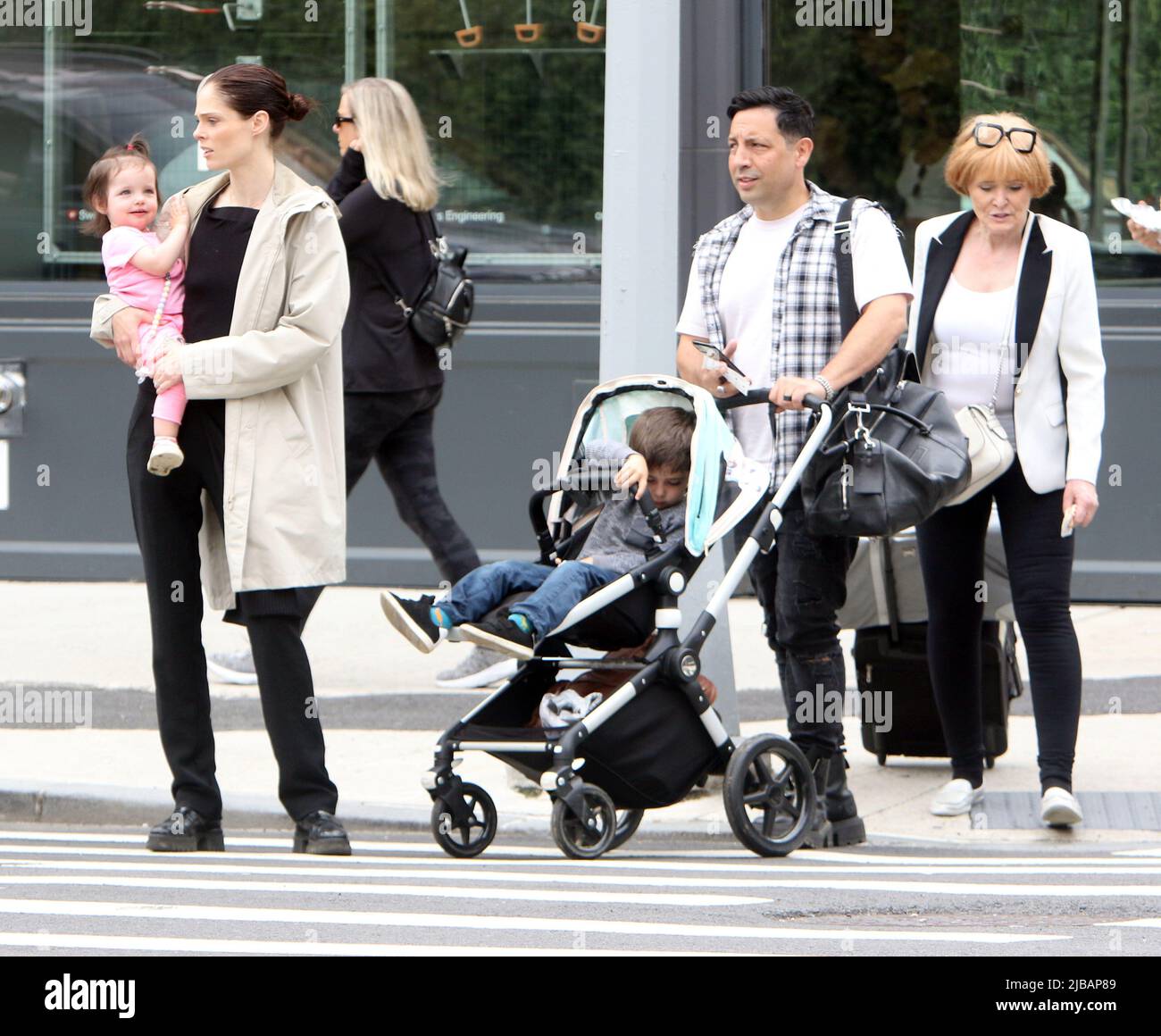June 03, 2022.Coco Rocha, James Conran, and family walking in Soho in ...