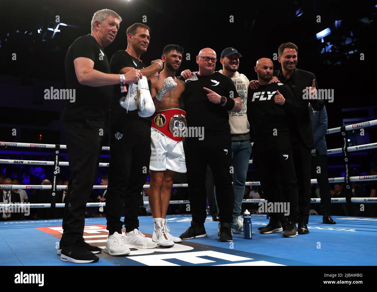 Joe Cordina (centre) celebrates defeating Kenichi Ogawa in the ...