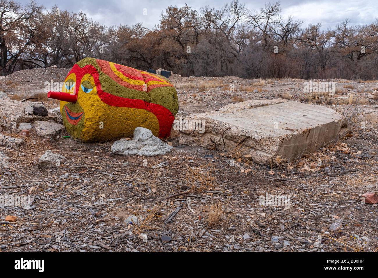 painted face on large concrete block (environmental art) along the ...