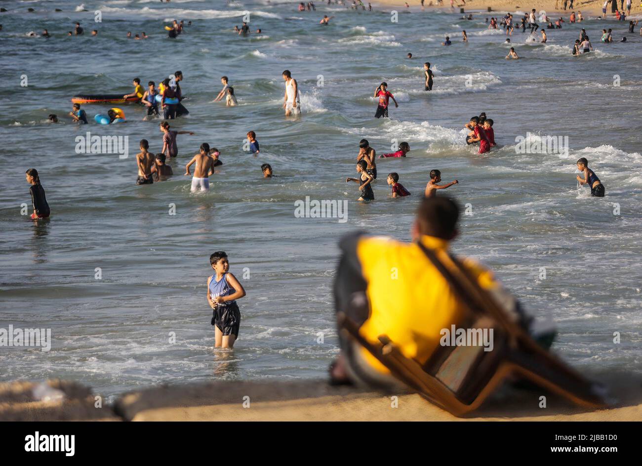 Palestinians enjoy their time on the shore of Jabalia Sea, in the ...