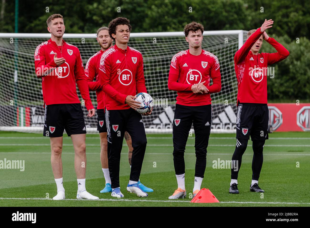 PONTYCLUN, WALES - 04 JUNE 2022: Wales' Chris Mepham, Wales' Wes Burns ...