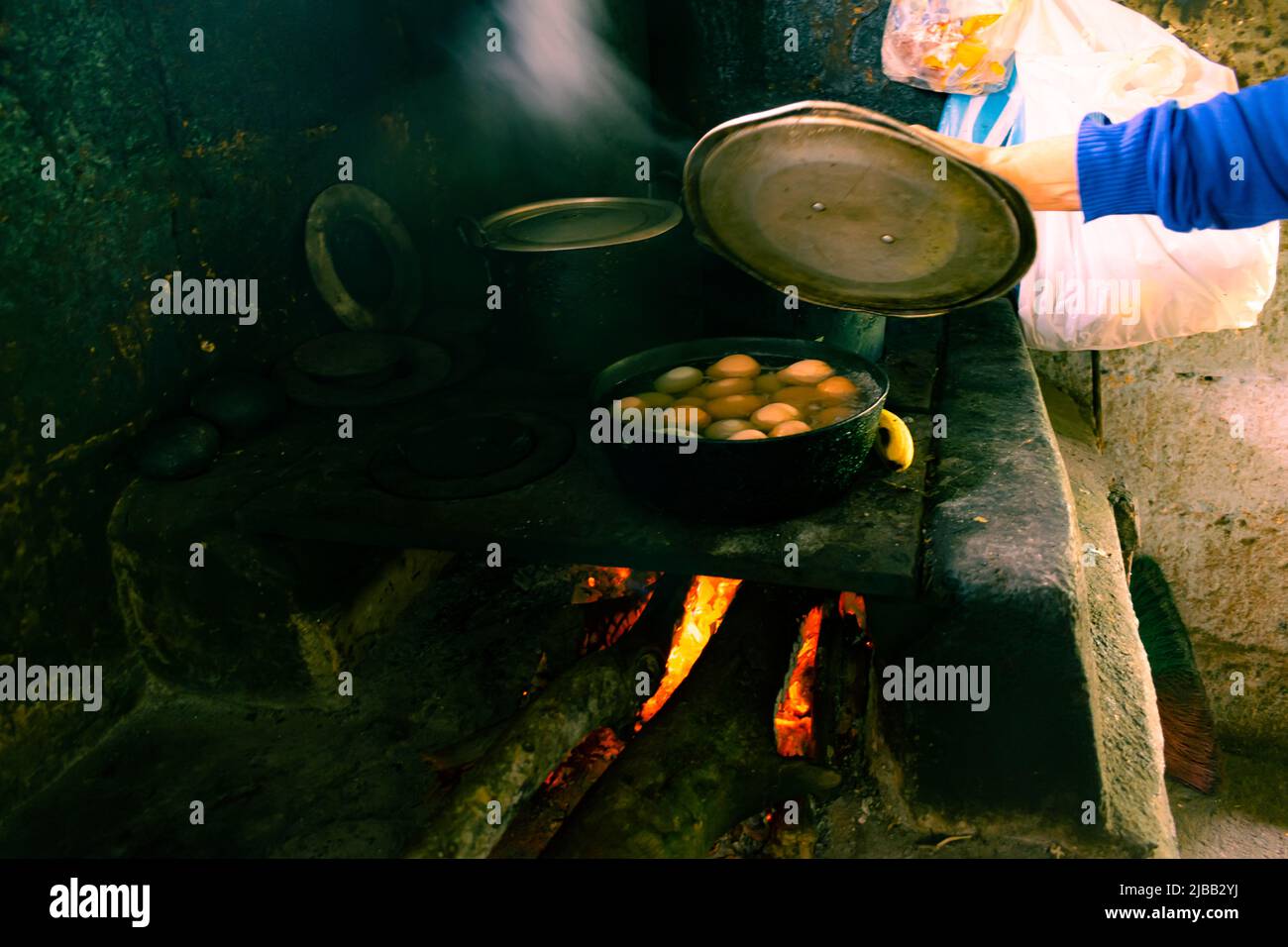 hands of a latin peasant woman cooking on a wood stove Stock Photo - Alamy