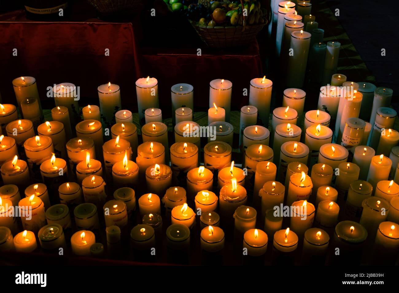 white candles lit in religious altar in holy week Stock Photo - Alamy