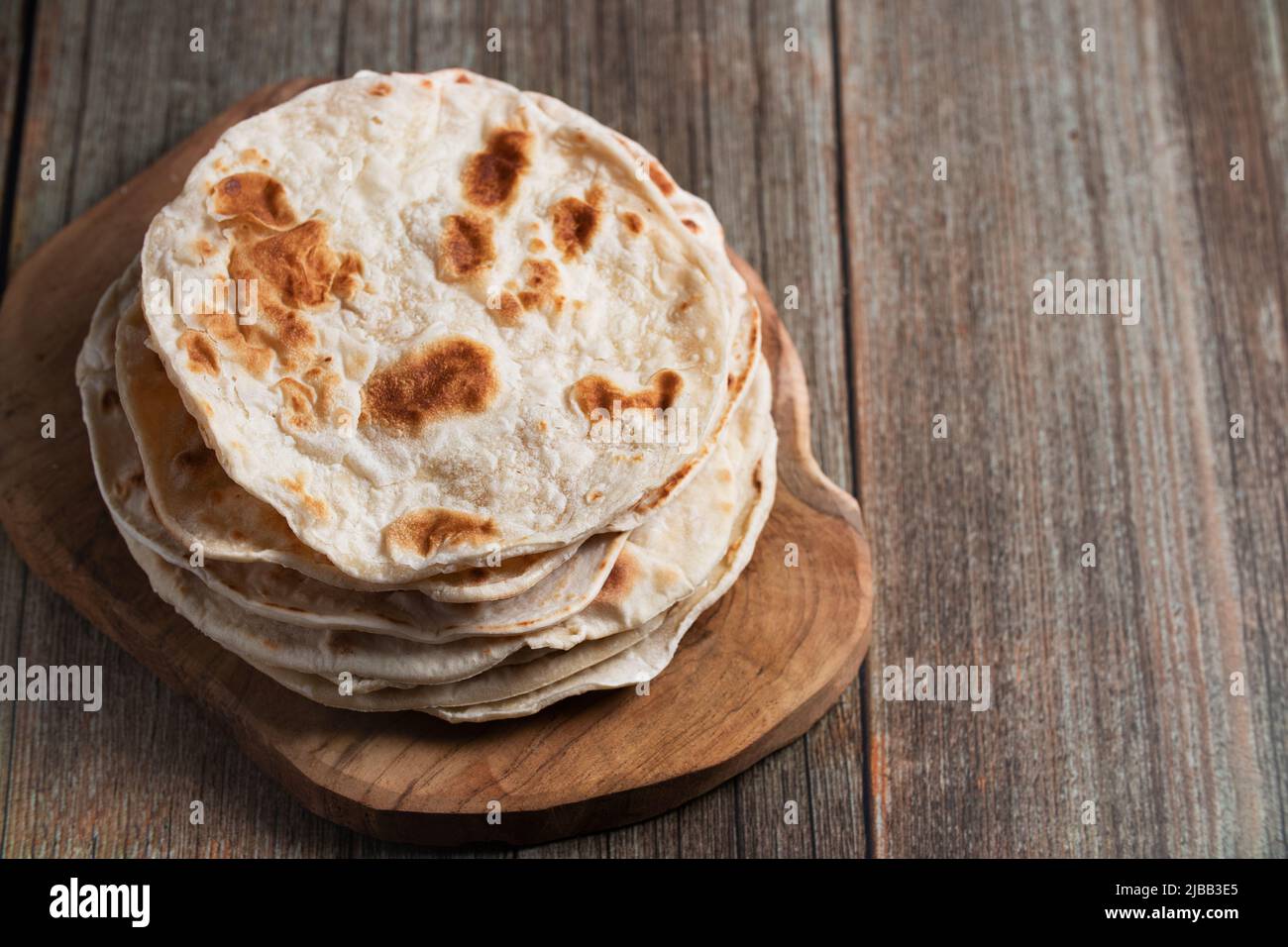 Indian chapati flatbread on the wooden table with copy space Stock ...