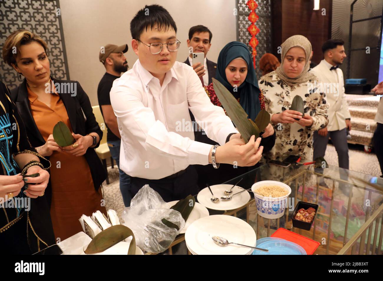 Baghdad, Iraq. 4th June, 2022. A Chinese young man teaches his Iraqi ...