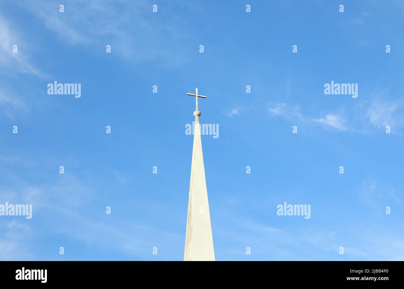 Cross tower reaches into sky religious attribute Stock Photo - Alamy