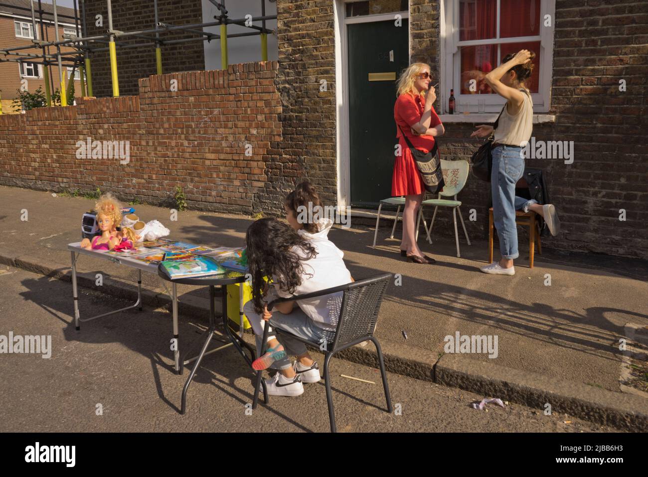 Neighbours at a community street party to commemorate Queen Elizabeth ...