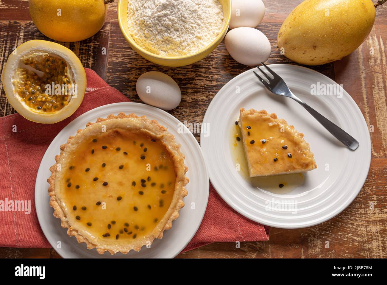 Homemade passion fruit pie with and a golden crust, on wooden ...