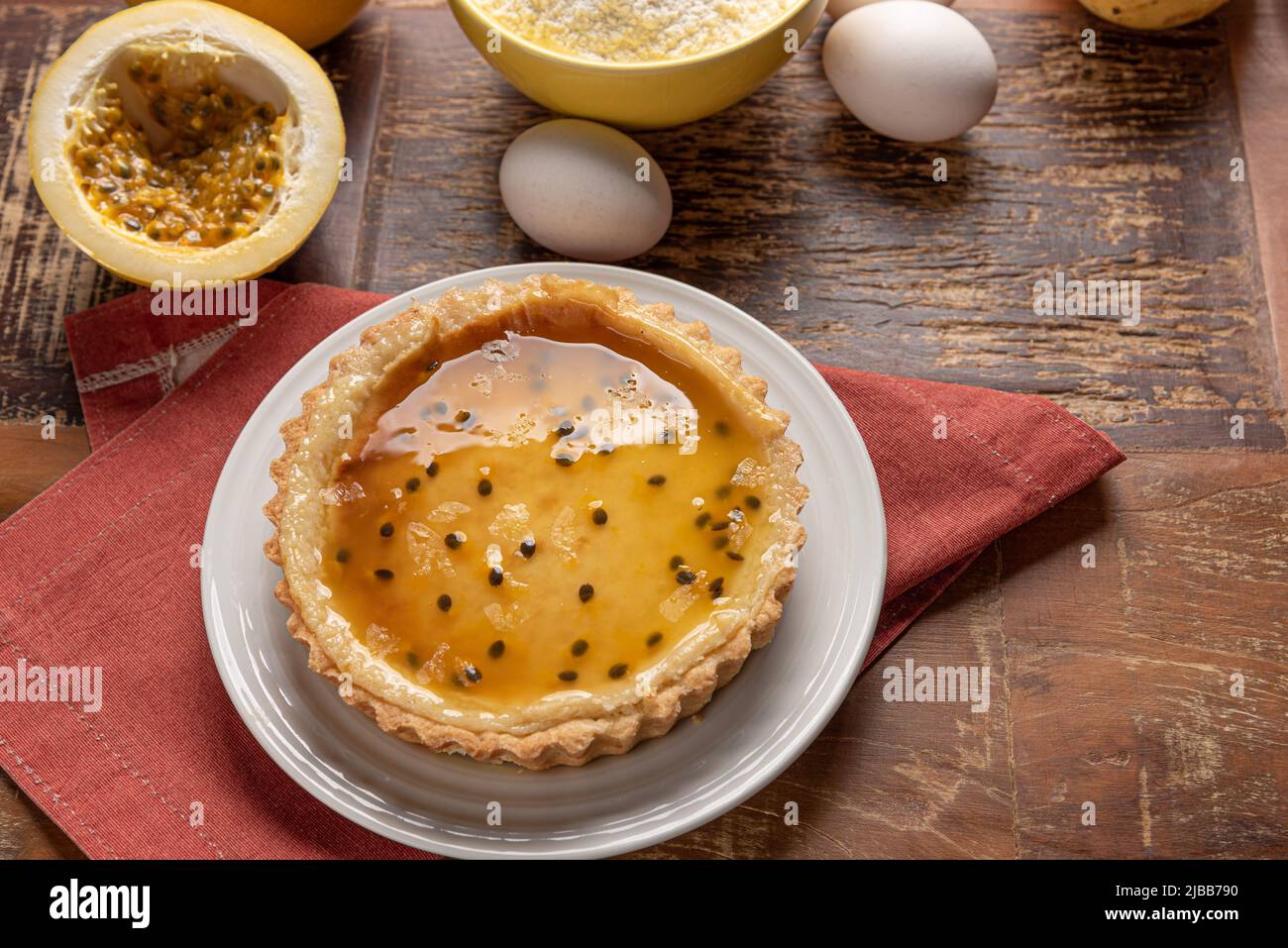 Homemade passion fruit pie with and a golden crust, on wooden ...