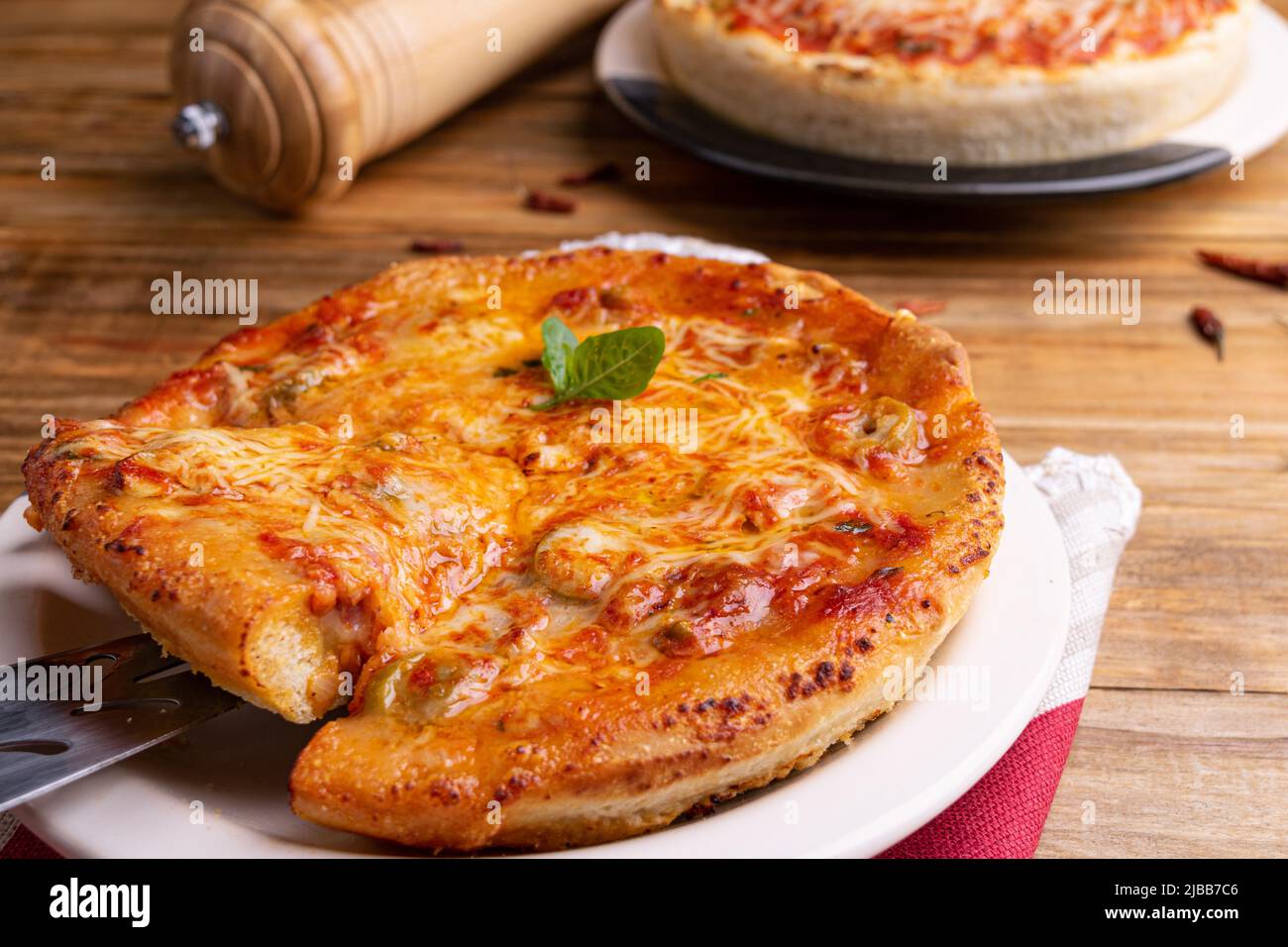 Chicago Style Deep Dish Cheese Pizza with Tomato Sauce, on wooden ...