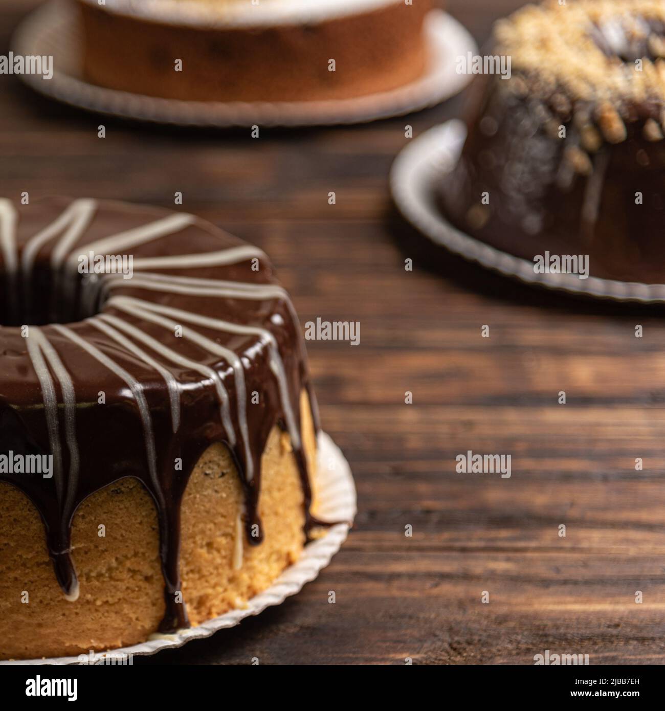 Various cakes on wooden background or table. Assortment of cakes for ...