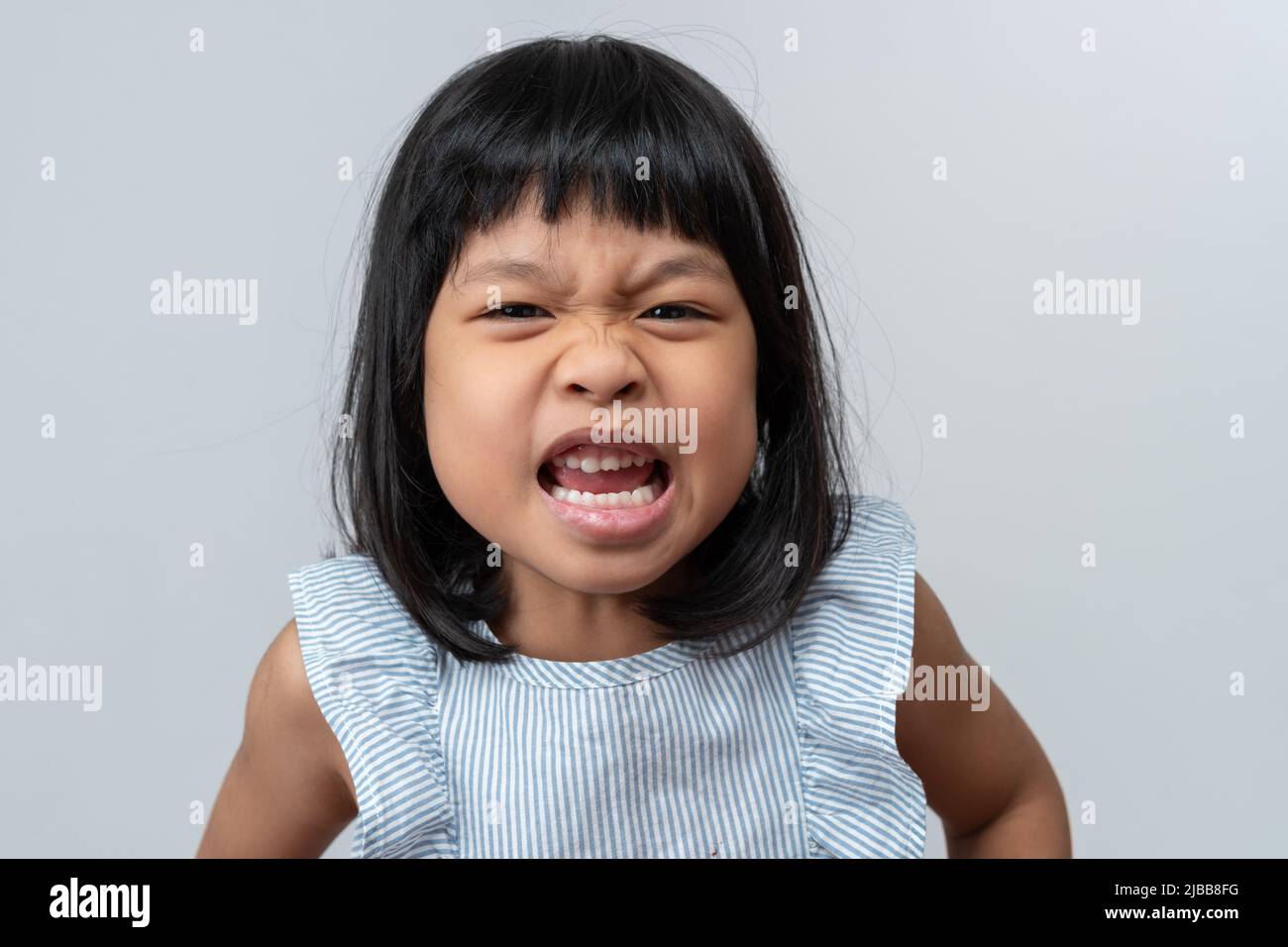 Portrait of angry emotional Asian girl screaming and frustrated ...