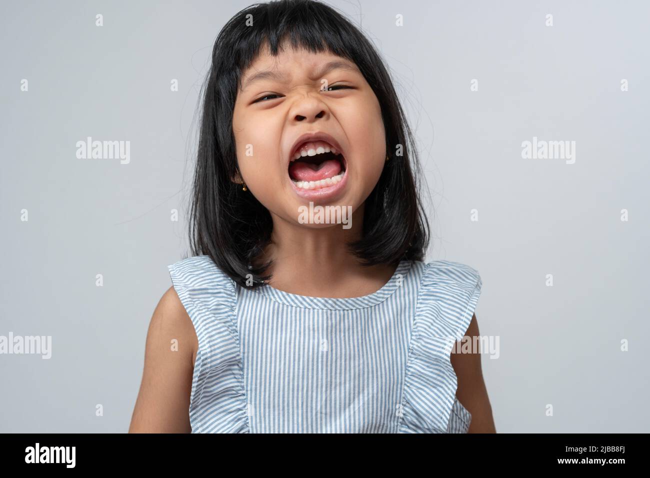 Portrait of angry emotional Asian girl screaming and frustrated ...