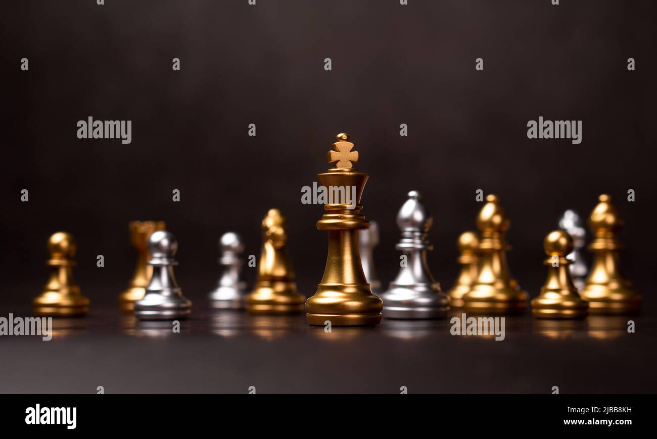 Golden Chess King standing to Be around of other chess, Concept of a ...