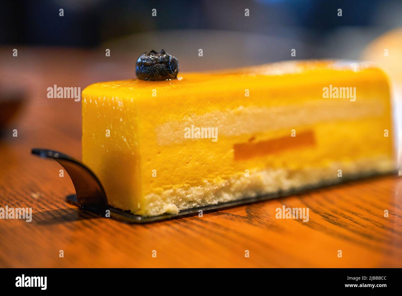 A delicious multi-layered mango mousse cake Stock Photo - Alamy
