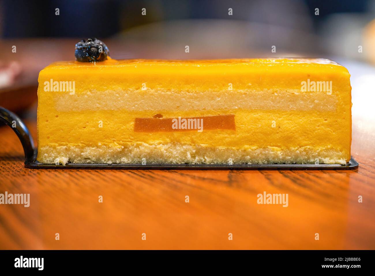 A delicious multi-layered mango mousse cake Stock Photo - Alamy
